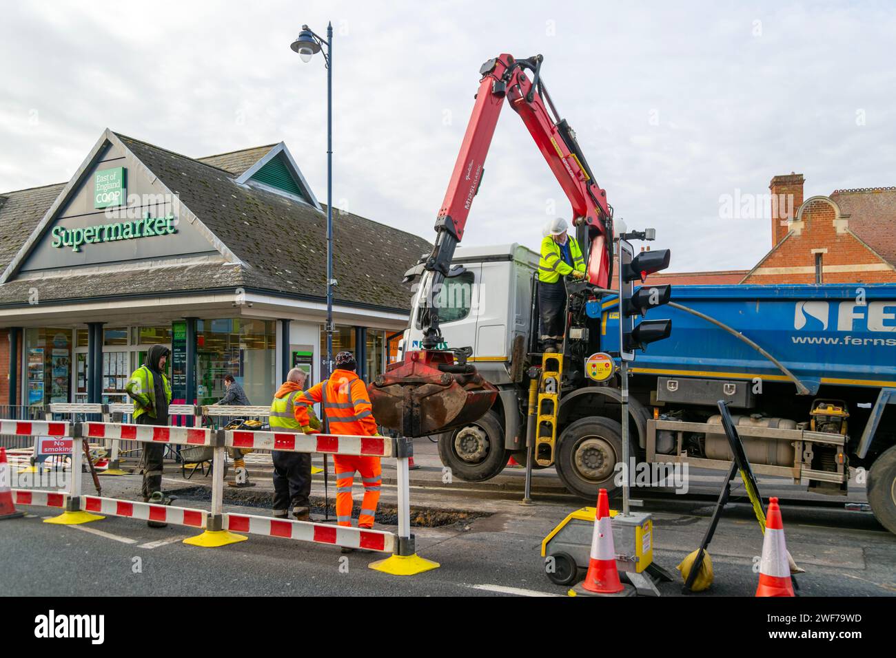 Grabber lorry delivering tarmac for road repairs, Felixstowe, Suffolk ...