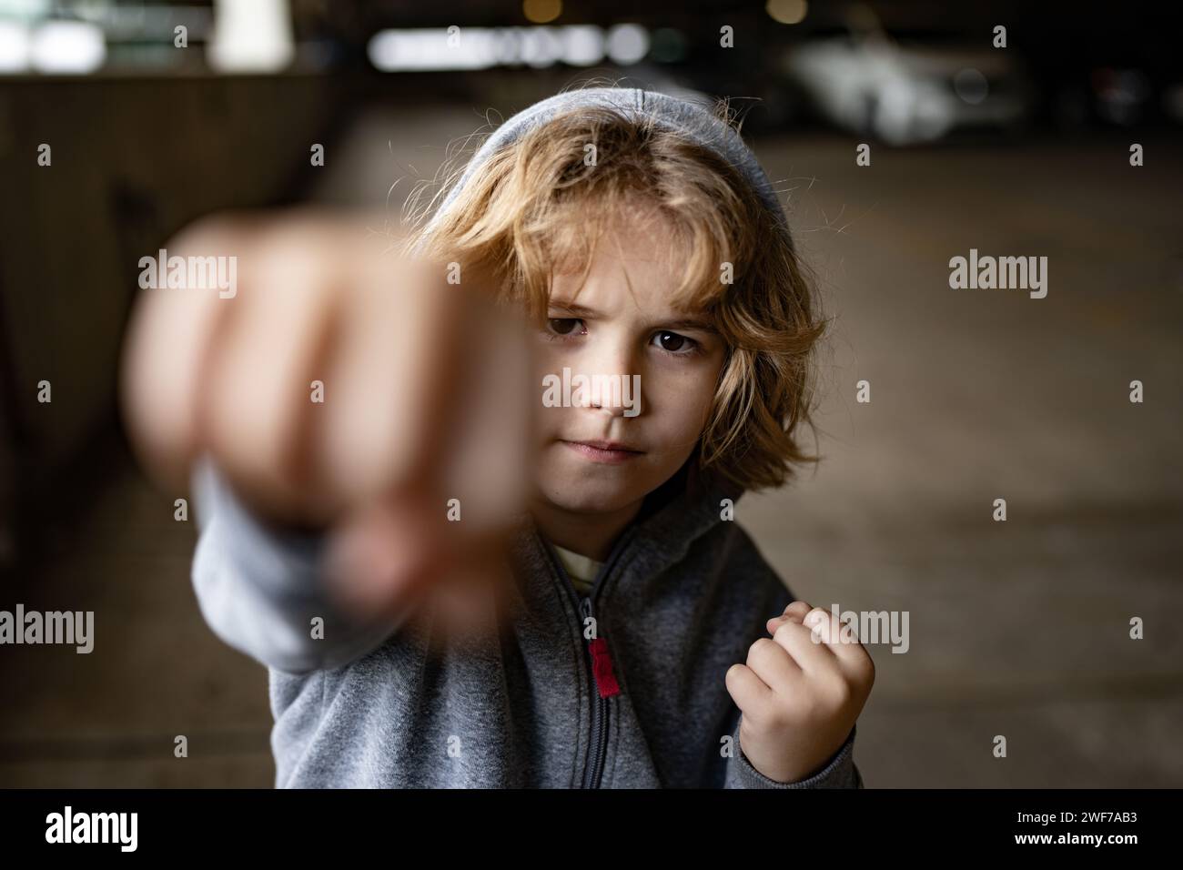 Aggressive child fight. Little kid boy fighting outside. Angry little ...