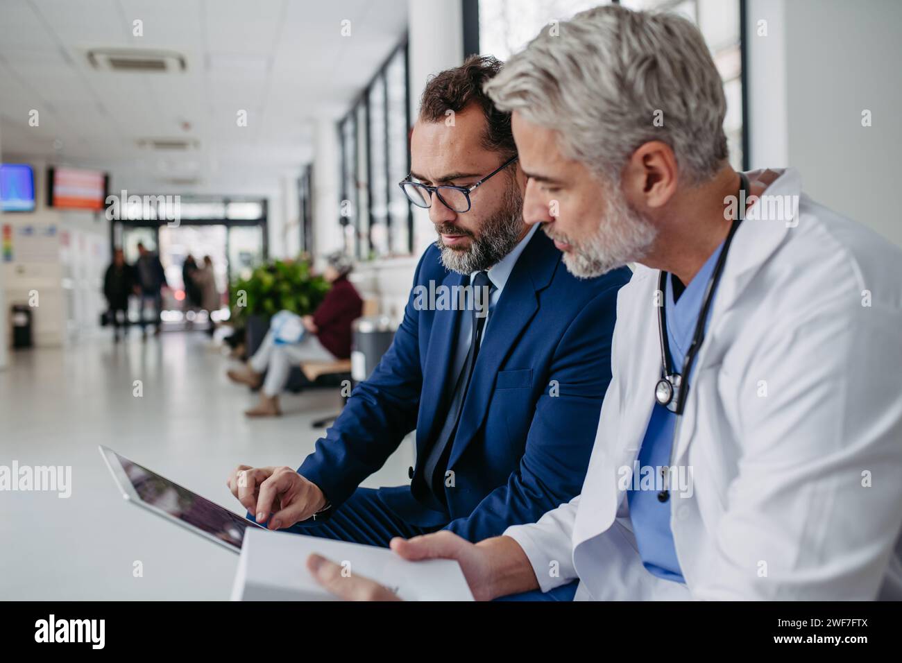 Doctor talking pharmaceutical sales rep hi-res stock photography and ...