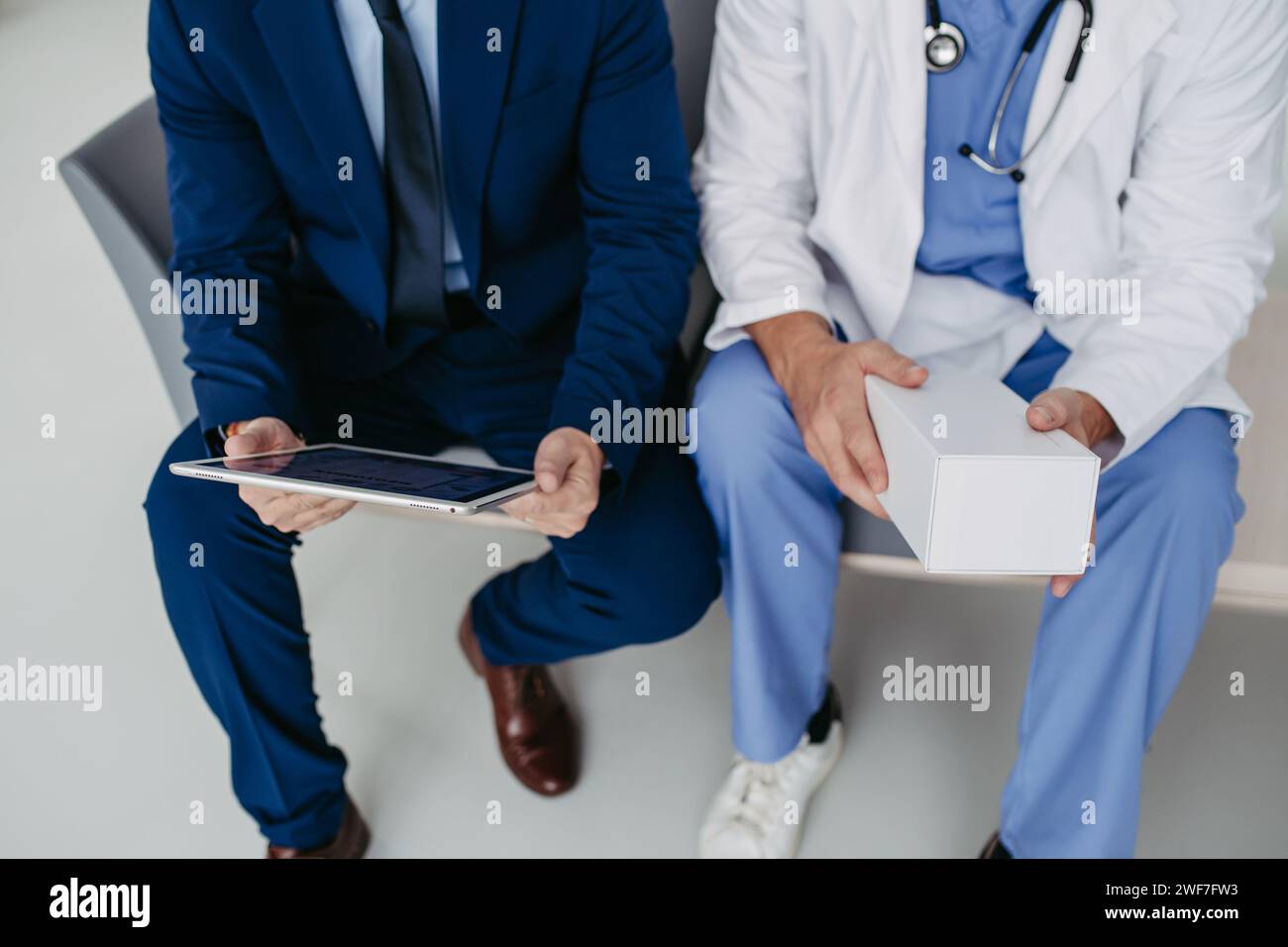 Doctor talking pharmaceutical sales rep hi-res stock photography and ...
