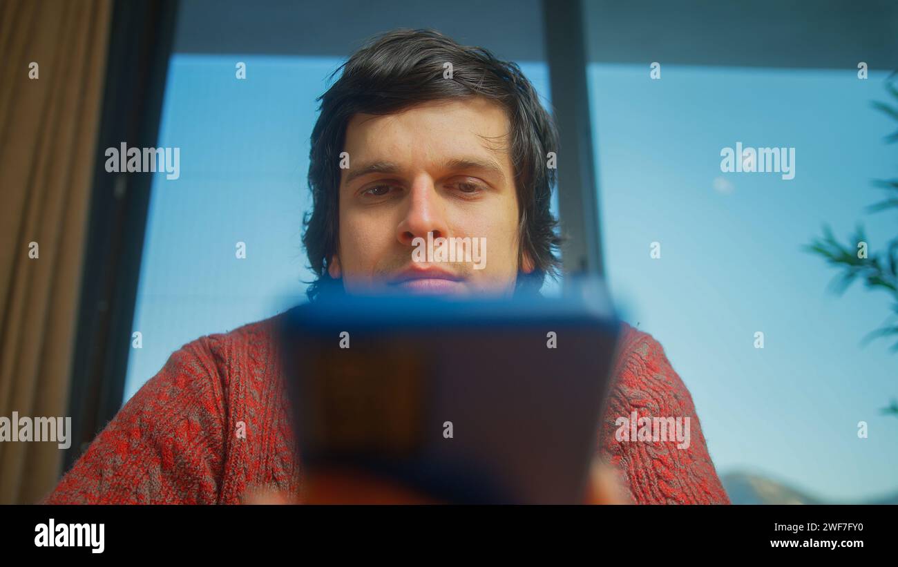 Mobile surprise man home hi-res stock photography and images - Alamy