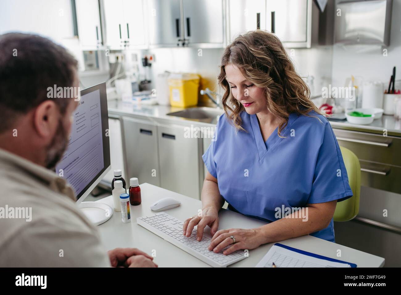 Doctor consulting with overweight patient, discussing test result and x ...