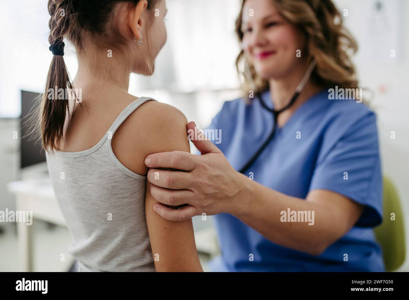 Orthopedist examines the spine, posture, and spinal deformities of ...