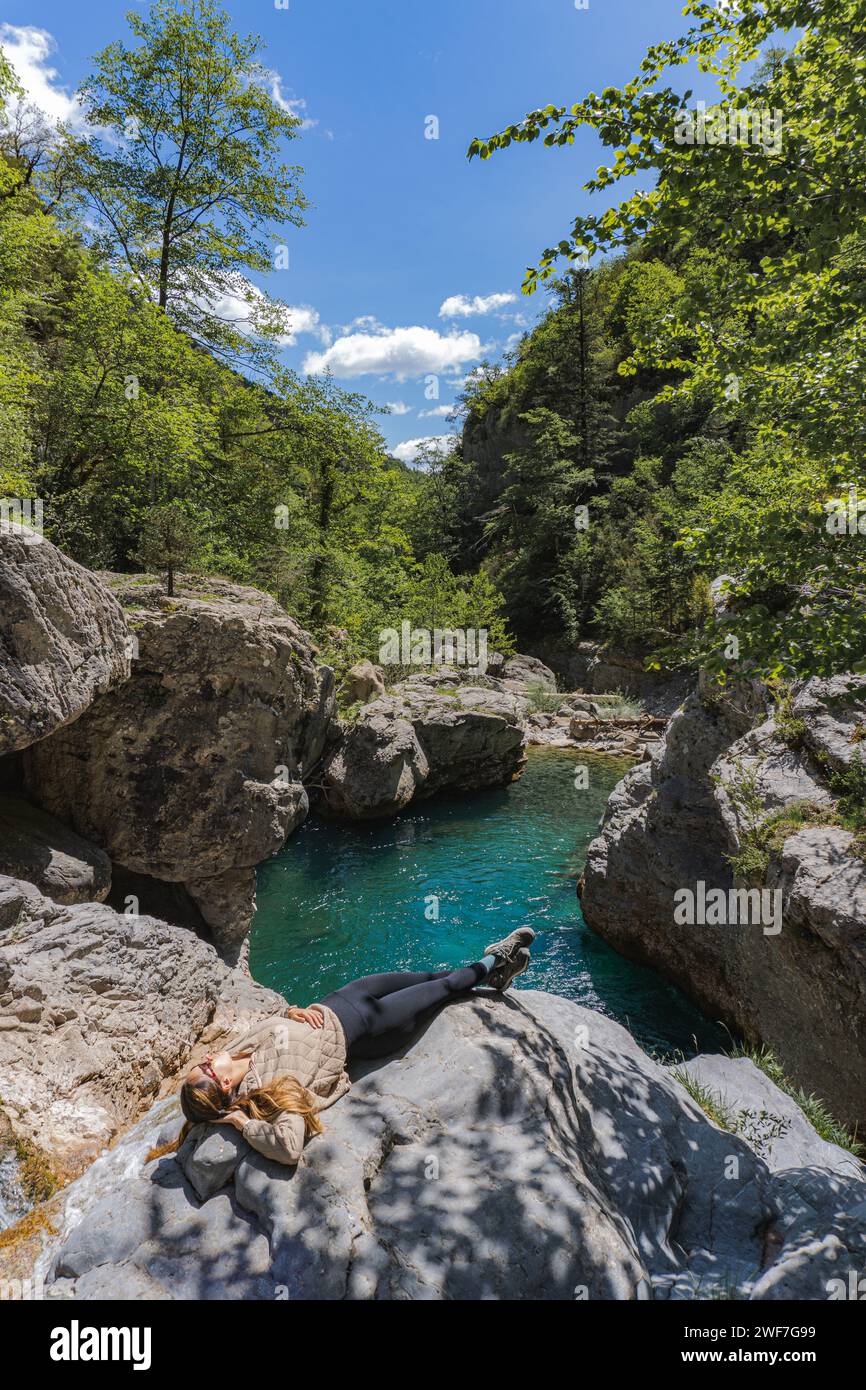 Female sunbathing on a rock hi-res stock photography and images - Alamy