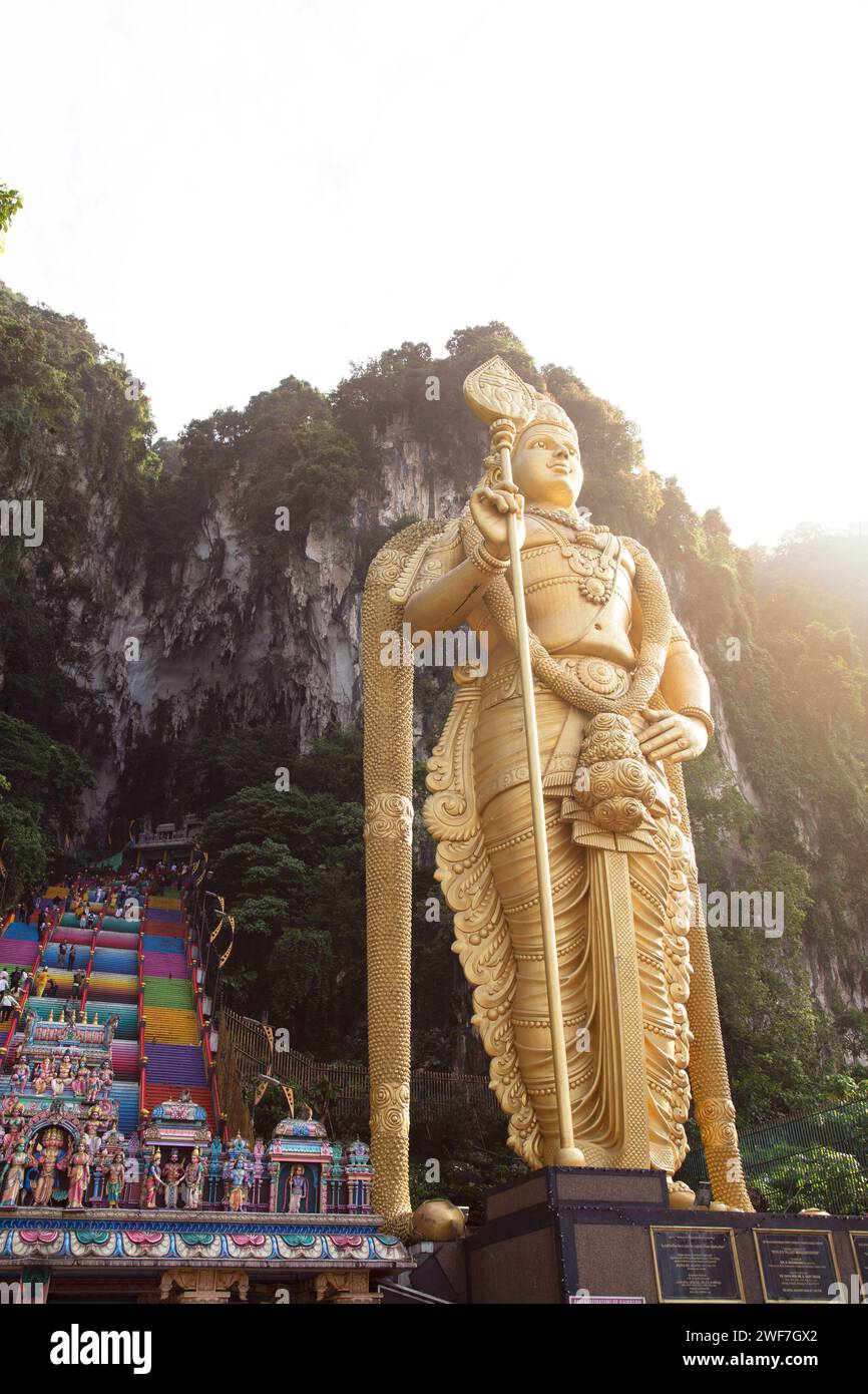 Golden statue of Maruga at Batu Caves during sunrise Stock Photo - Alamy