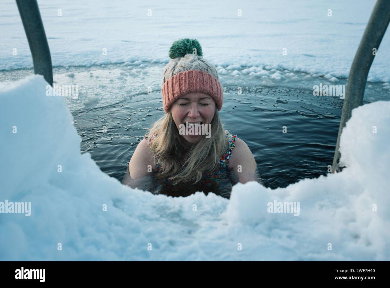 woman screaming whilst ice water cold water swimming in Scandinavia ...