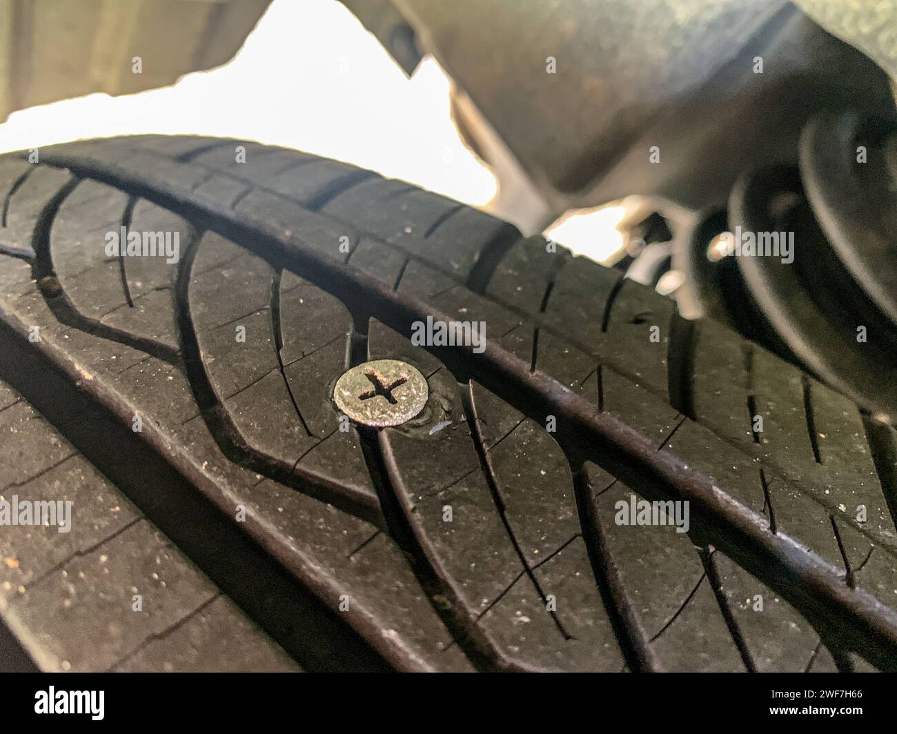 Screw Stuck in Car Tire Stock Photo - Alamy