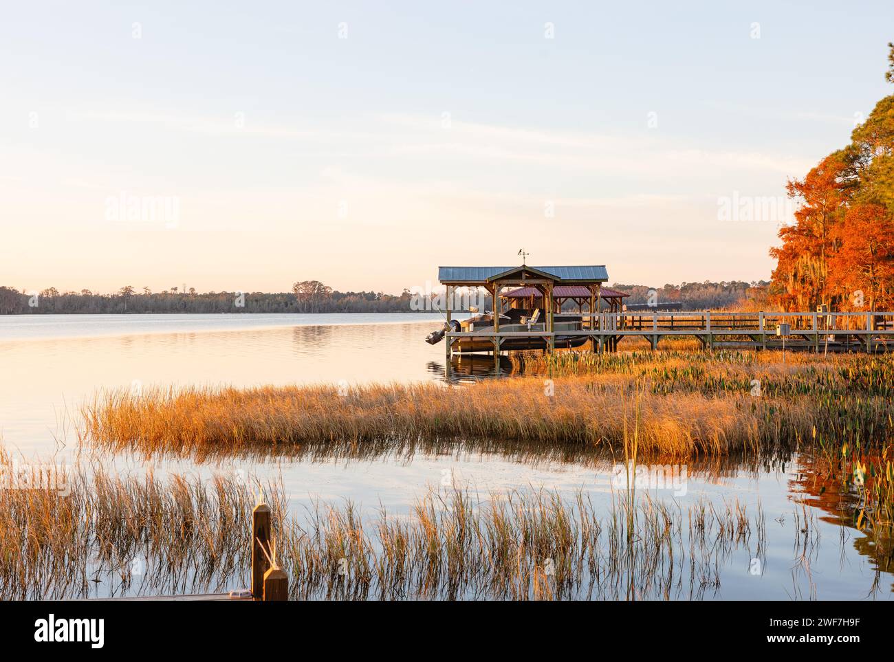 Serene lake setting with dock on right and negative space on left Stock ...