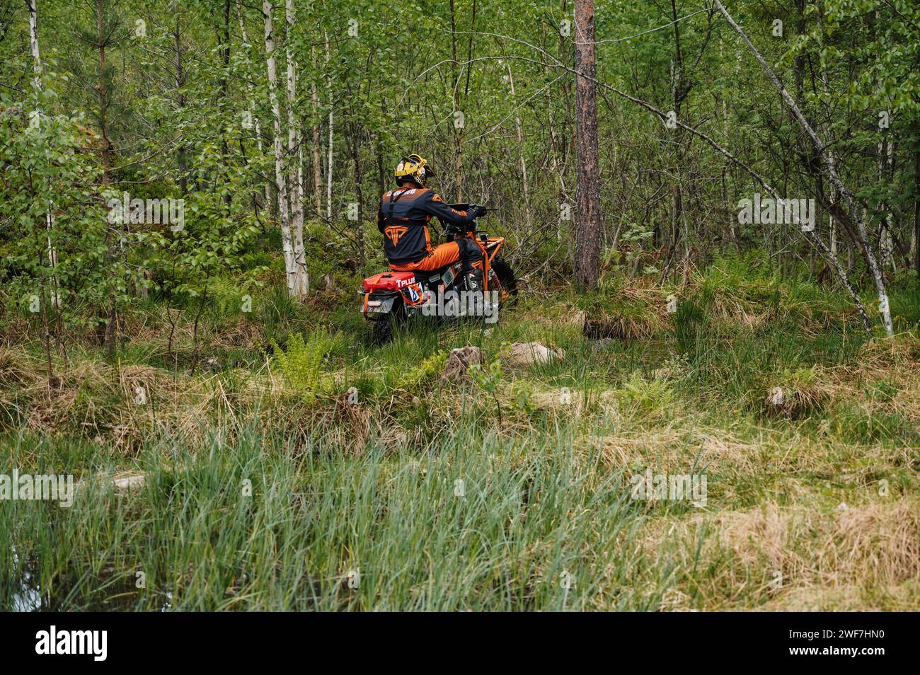 Man rides motorcycle through mud hi-res stock photography and images ...