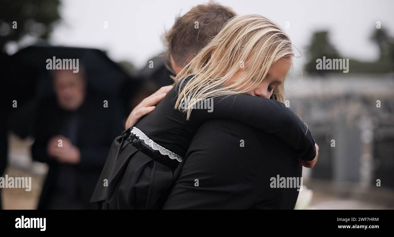 Sad, death and a girl with her father at a funeral for grief or ...