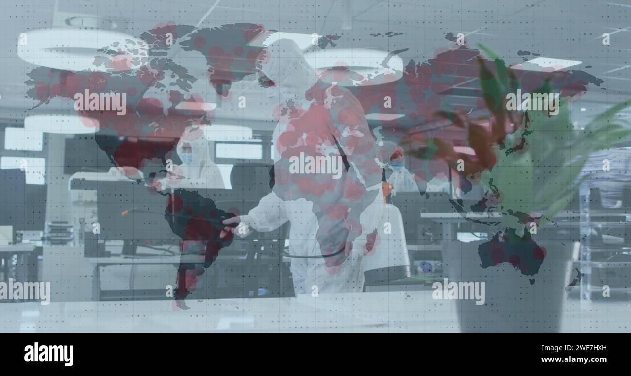 Image of world map turning red with man disinfecting the office Stock ...