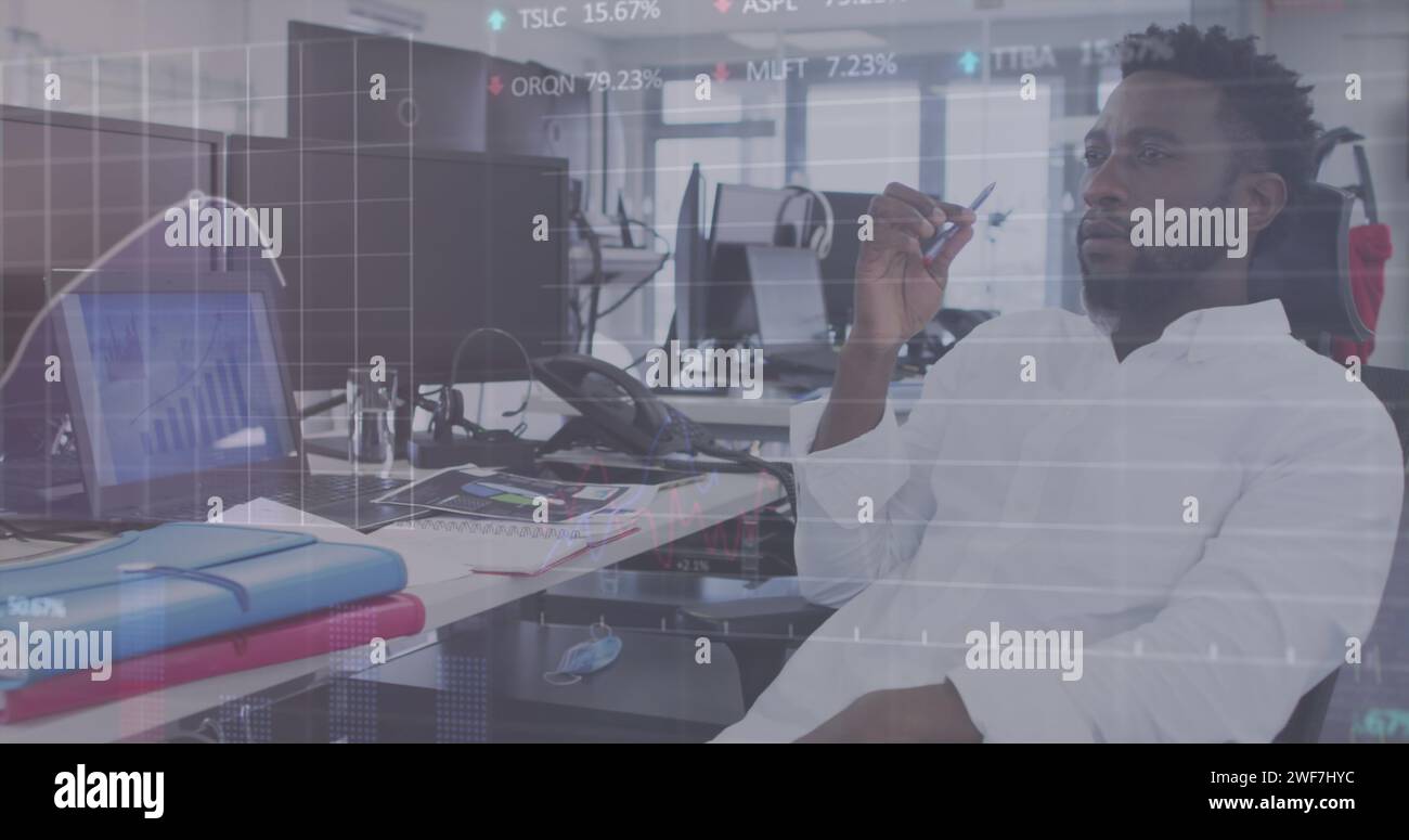 Image of digital interface showing statistics with man working in an ...