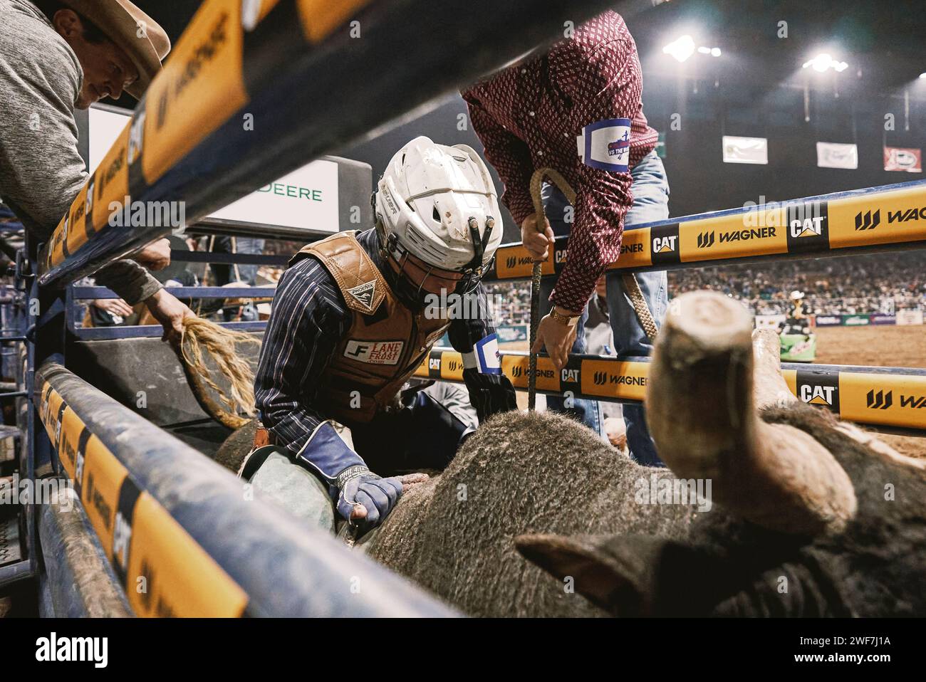 Bullrider in the bullpen before competition in rodeo Stock Photo - Alamy