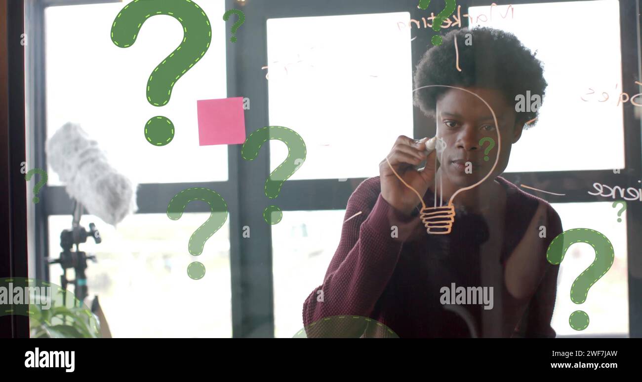 Image of question marks over african american businessman in office ...