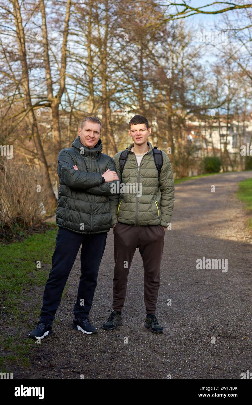 Father-Son Bond: Handsome 40-Year-Old Man and 17-Year-Old Son Standing ...