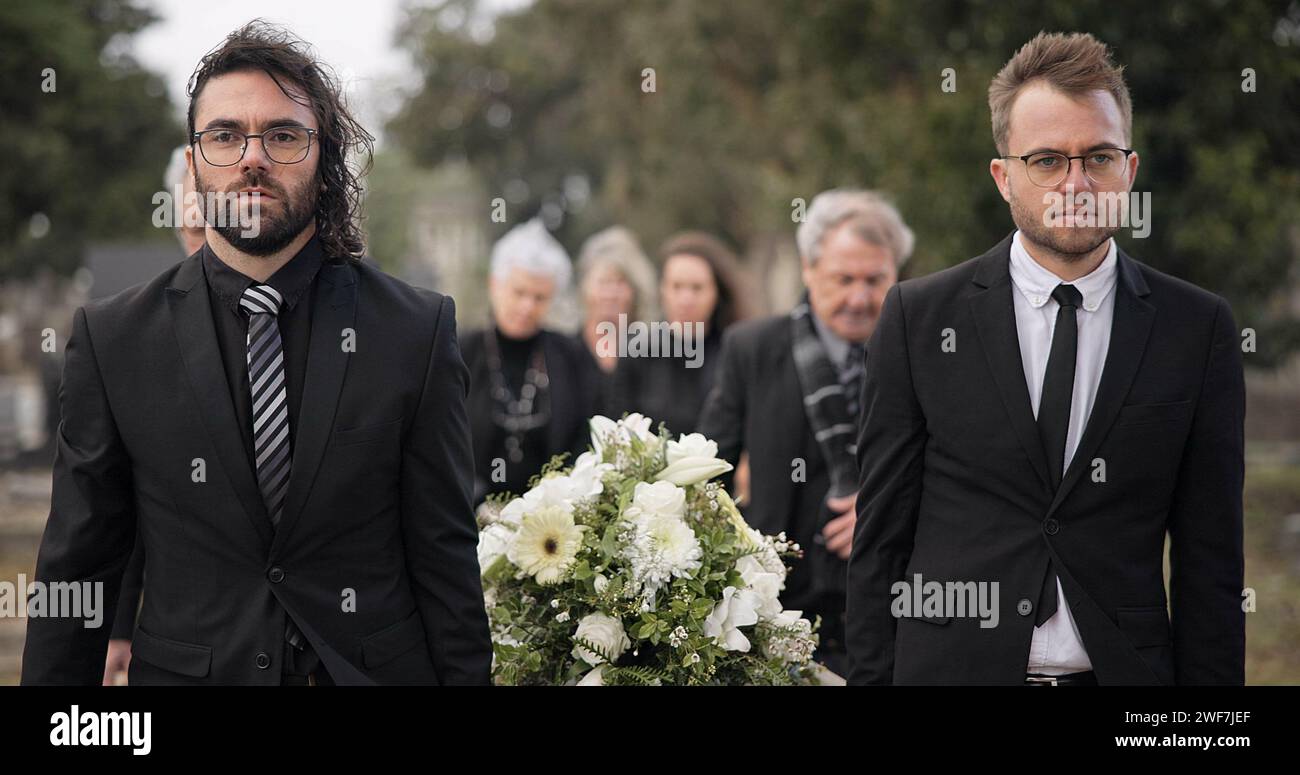 Pallbearers, men and walking with coffin at graveyard ceremony outdoor ...