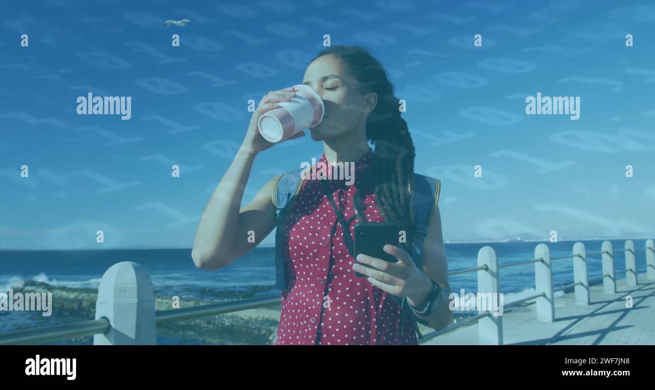 Image of floating numbers over woman drinking coffee and using ...