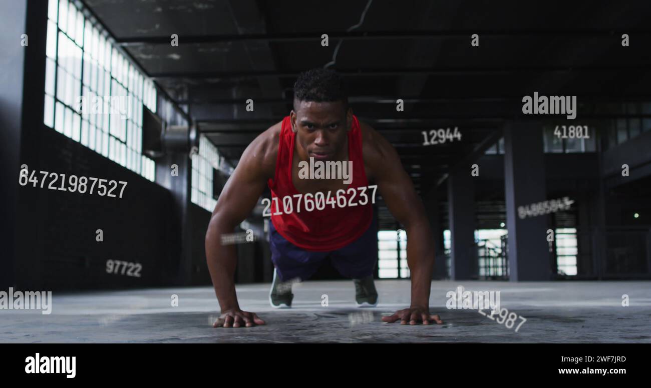 Image of falling numbers over man doing push ups in an abandoned ...
