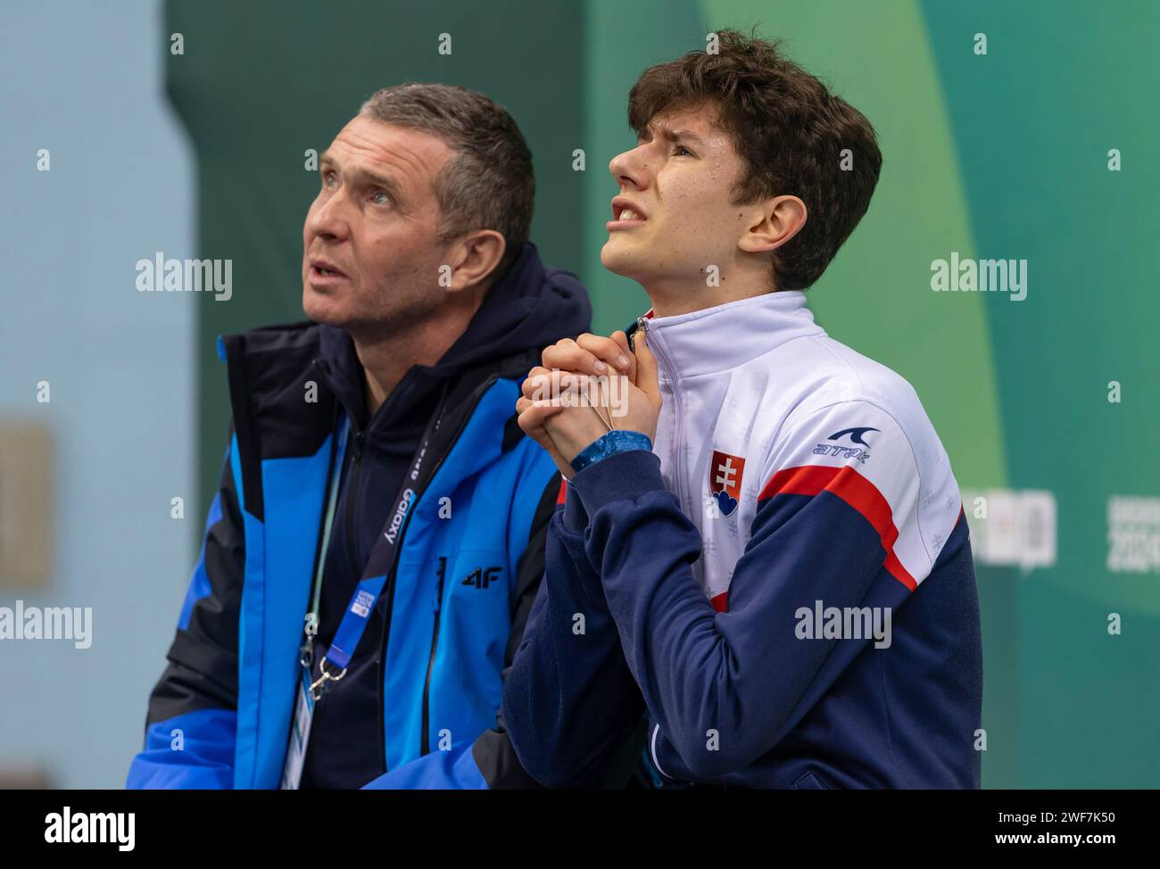 Adam Hagara, right, of Slovakia looks on from the team bench during the ...