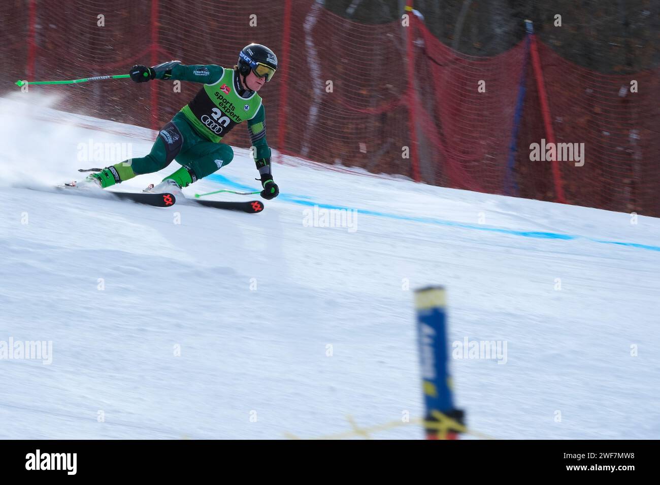 A ski racer competing in Quebec Super Series Giant Slalom race at Mont ...