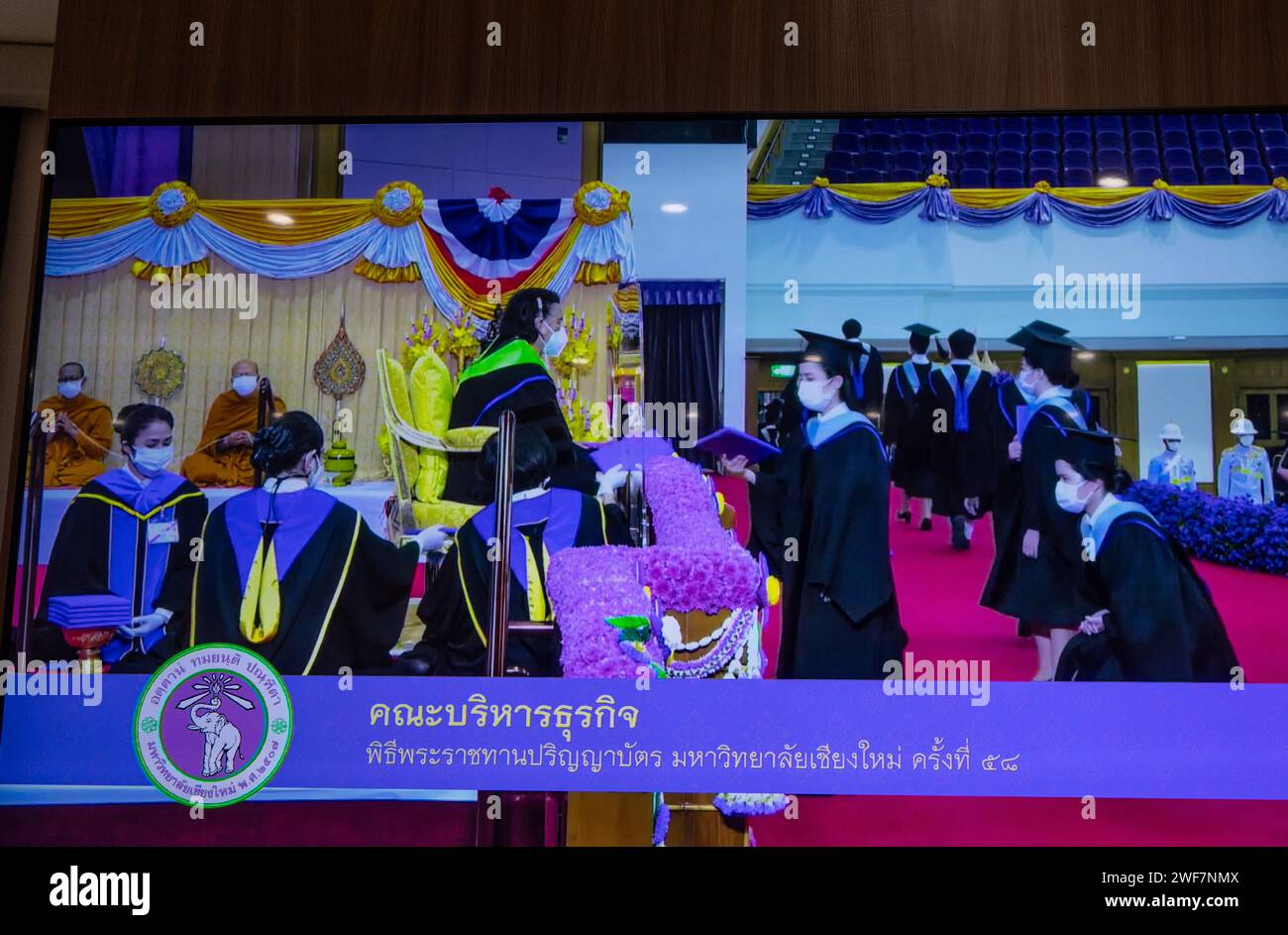 TV screen showing Thai royal princess giving diplomas at graduation ...