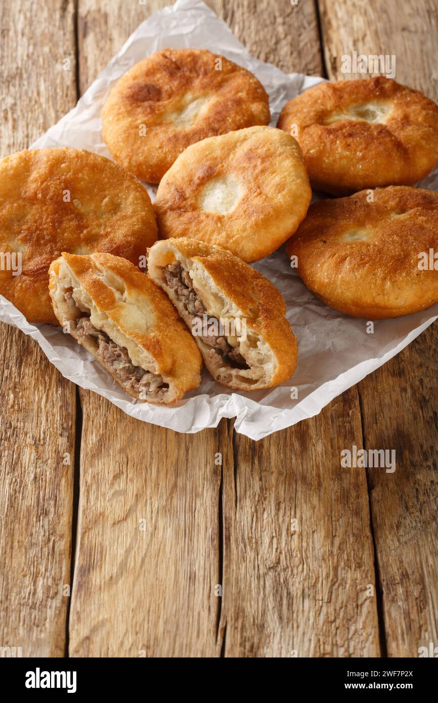 Traditional Russian deep fried meat patties belyash closeup on the ...
