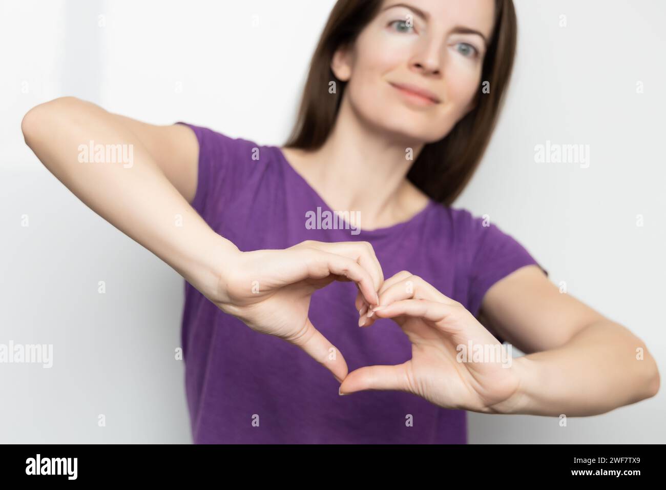 Inspire inclusion. Zoomers symbolize love. Woman finger heart dressed ...