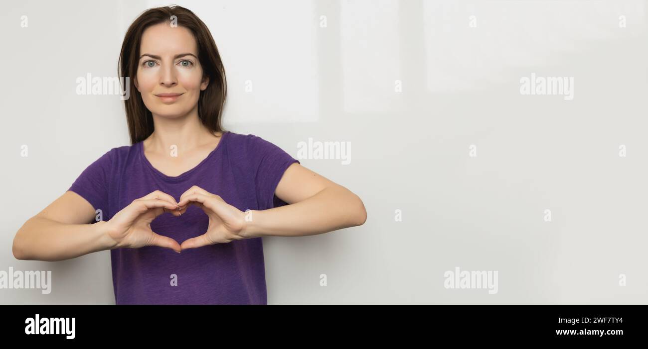 Inspire inclusion. Zoomers symbolize love. Woman finger heart dressed ...