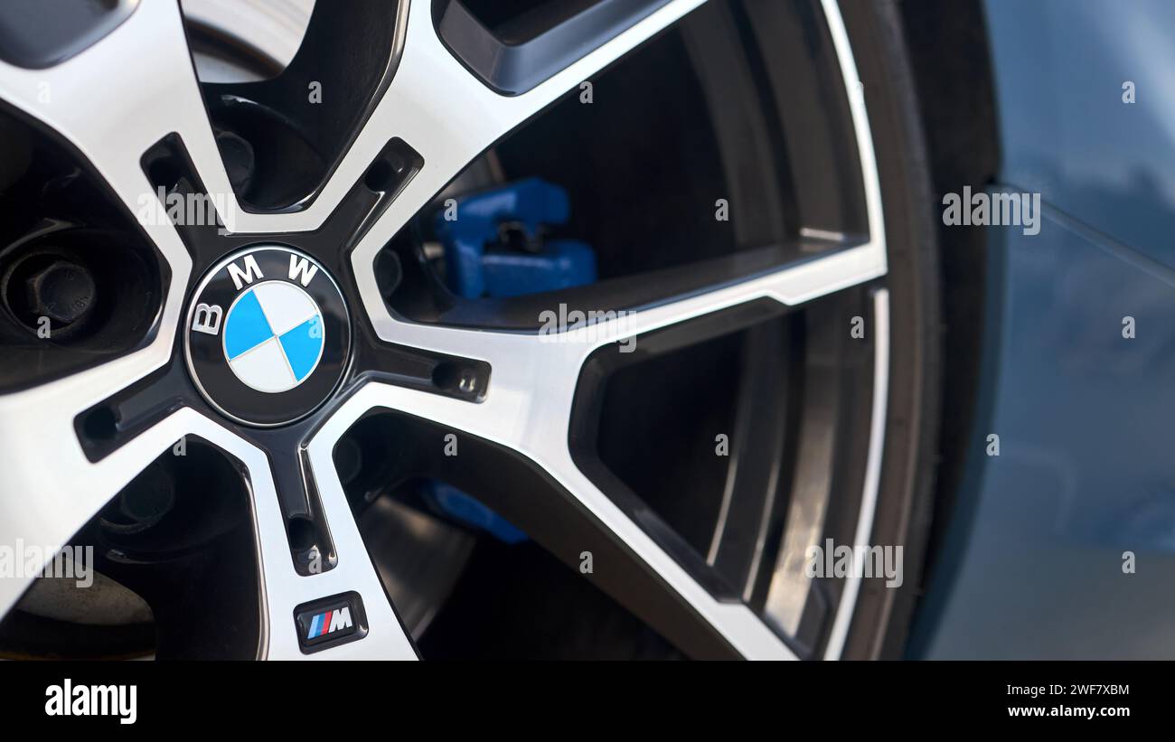 Berlin - August 2022: BMW 8 Series xDrive M-pack car closeup alloy wheel with low profile tires ...