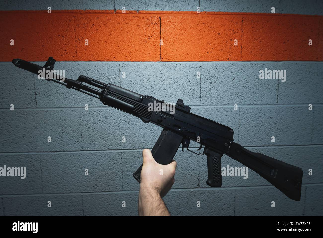 Russian assault rifle AK 74m with a collimator sight in a man's hand ...