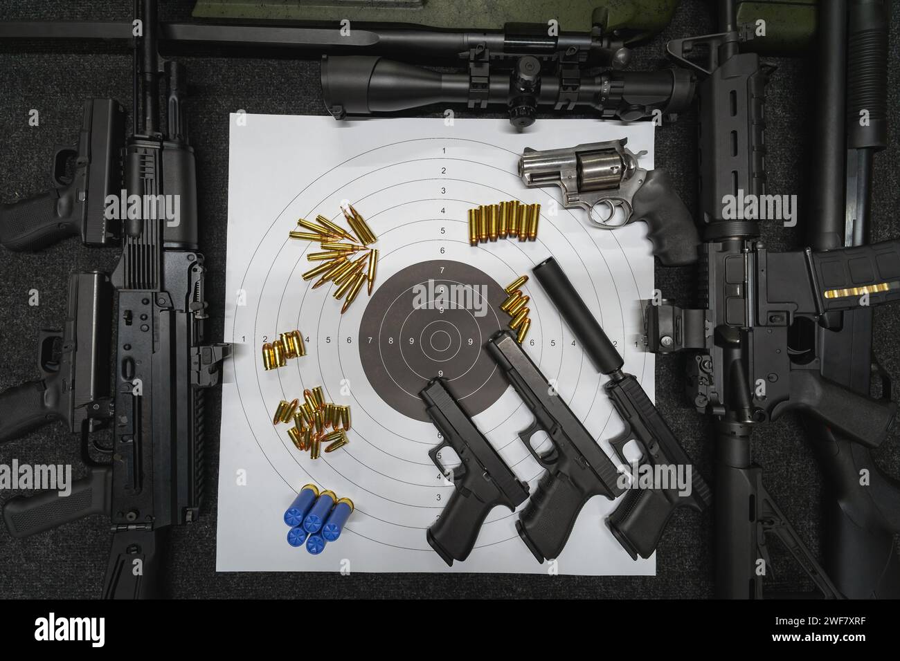 Firearms, tactical guns, rifles, pistols and a shooting target. High ...