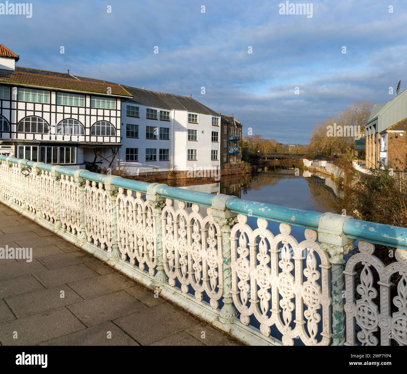 View from bridge, reflection of buildings in water of River Tone ...