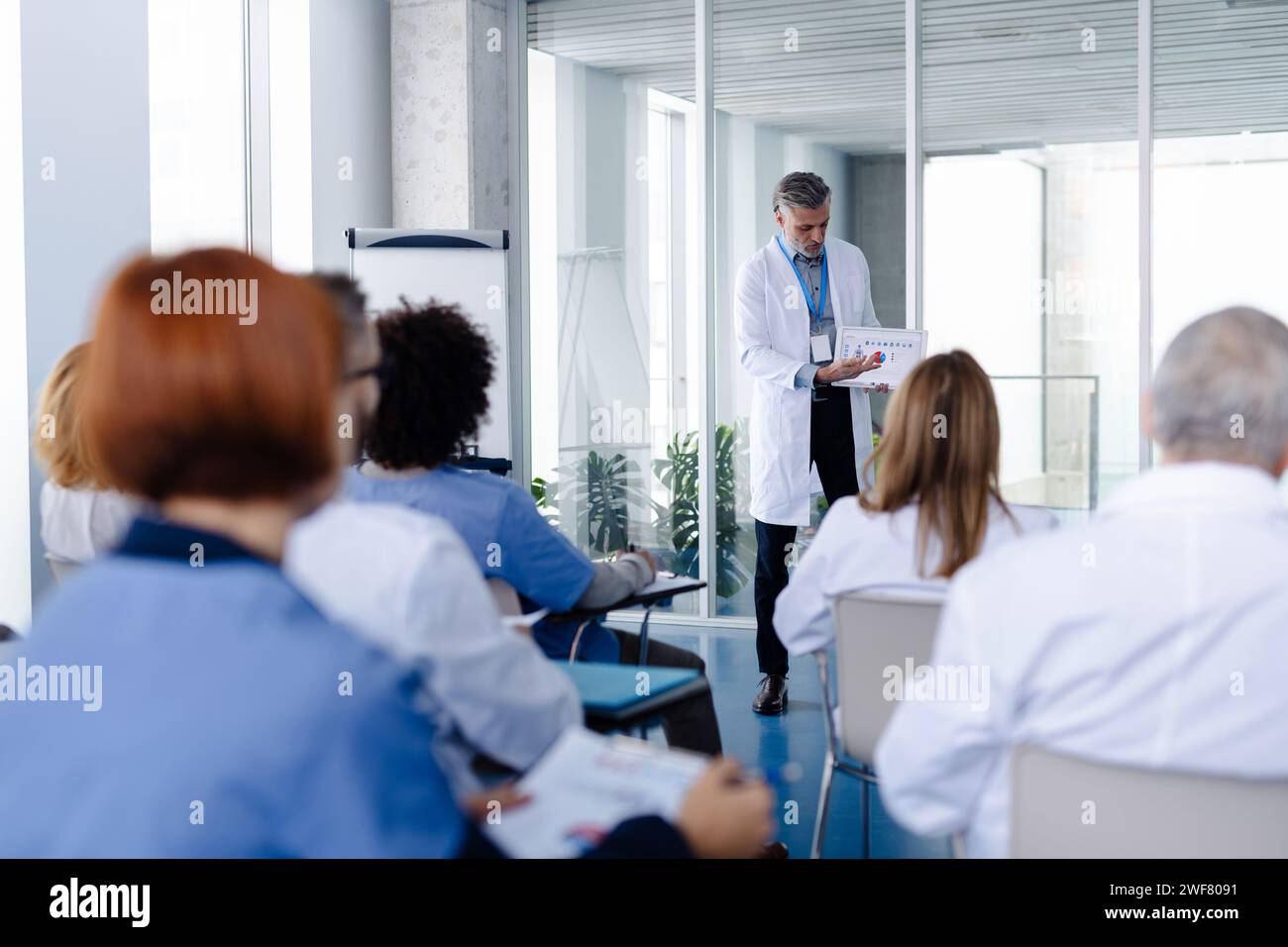Doctor as speaker at conference for healtcare workers, medical team ...