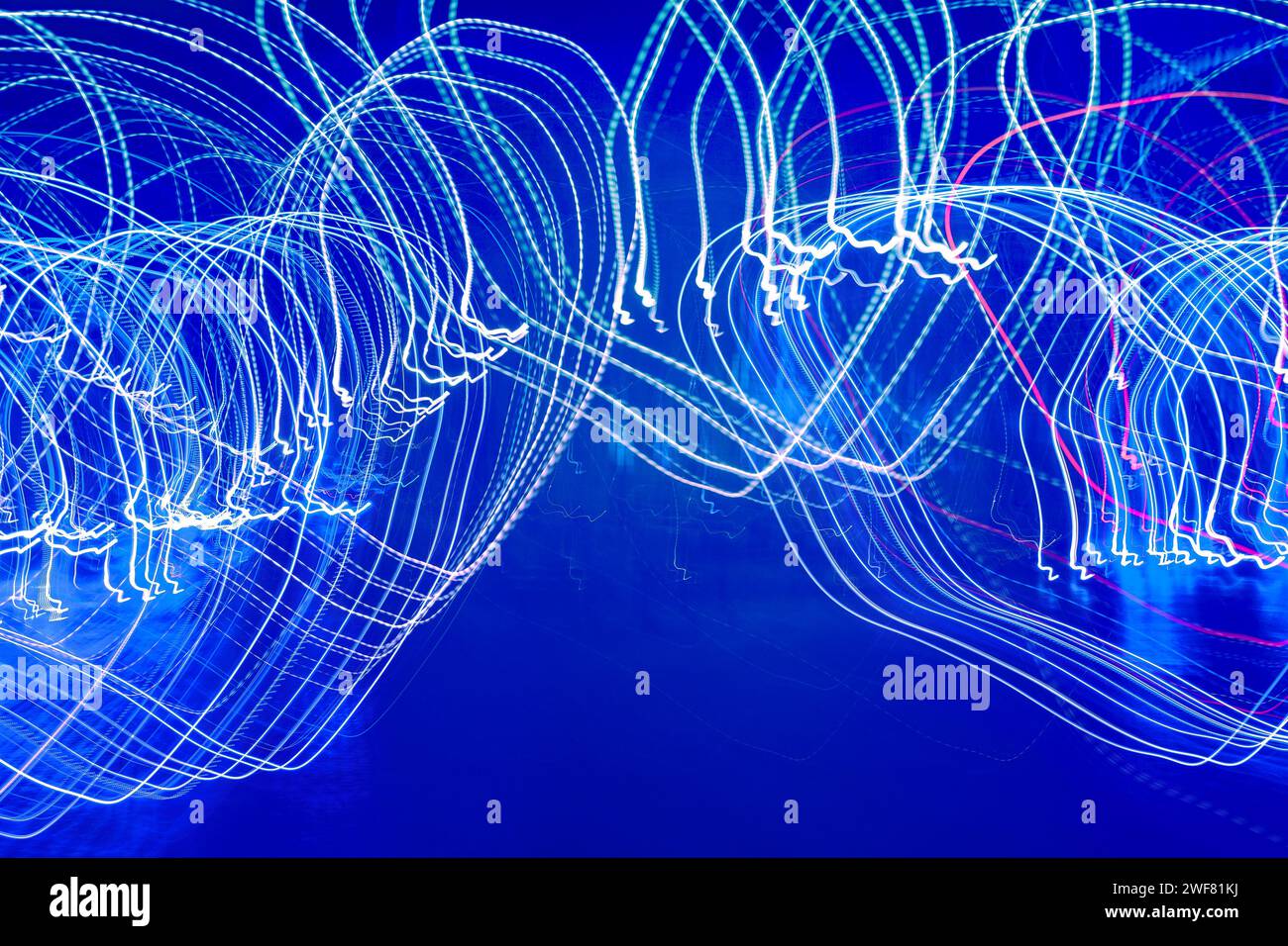 Drawing with light in the dark. Abstract background. Long exposure ...