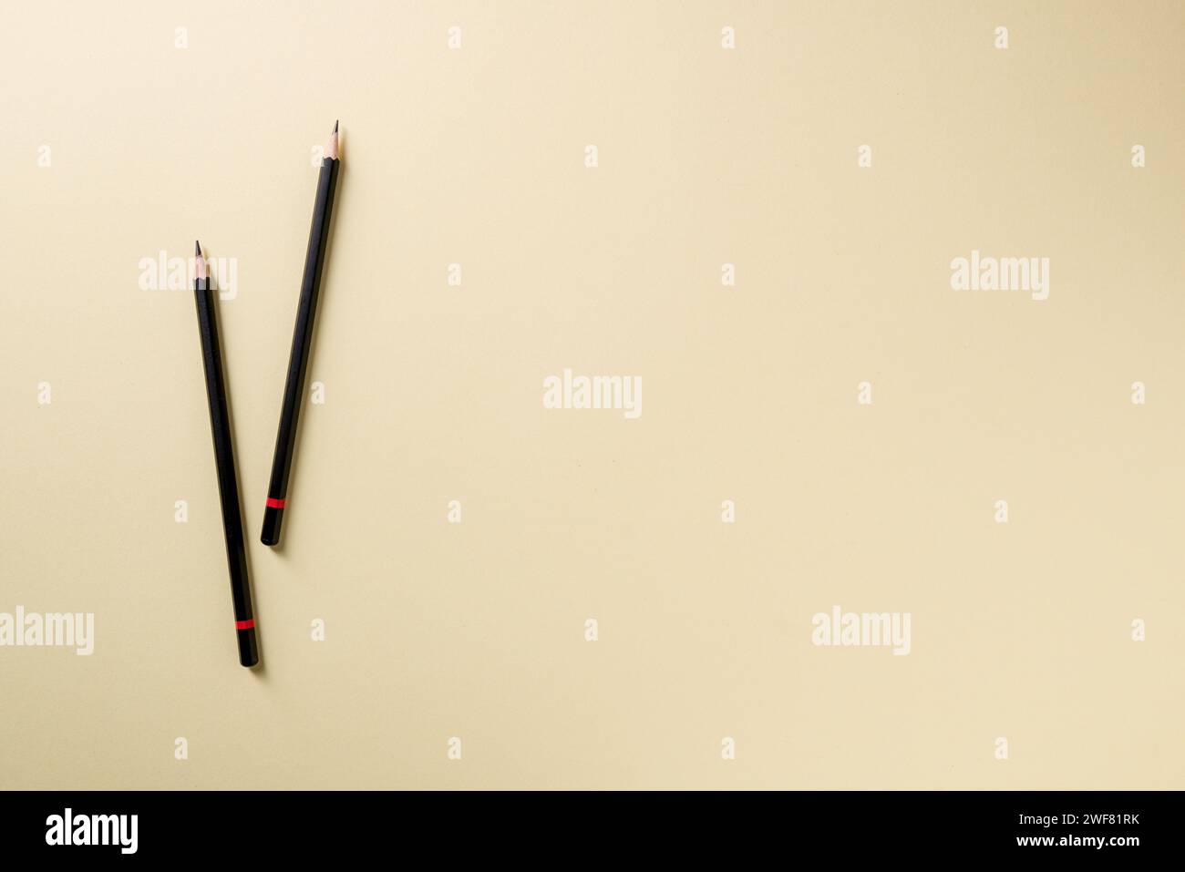 Pencil with black paint and a red stripe on a yellow background Stock ...