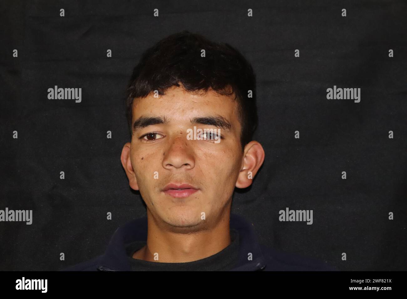 Picture of himalayan adult man with a black backround Stock Photo - Alamy