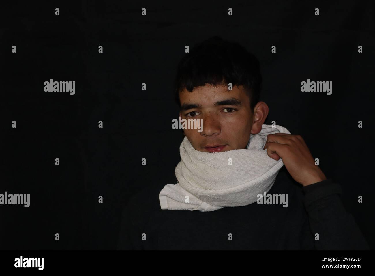 Picture of himalayan adult man with a black backround Stock Photo - Alamy