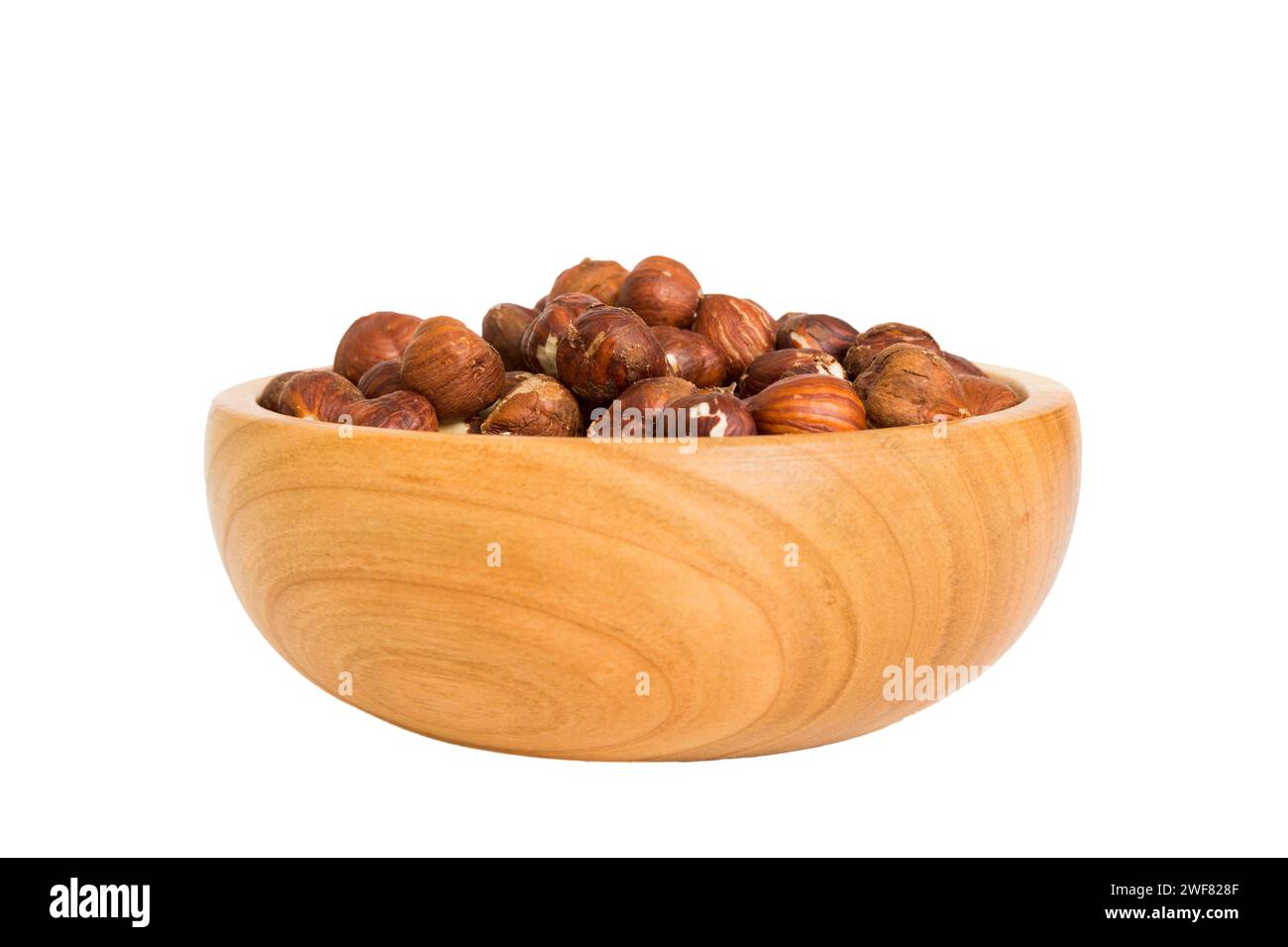 Roasted hazelnut in bowl isolated on white background. hazelnut is ...