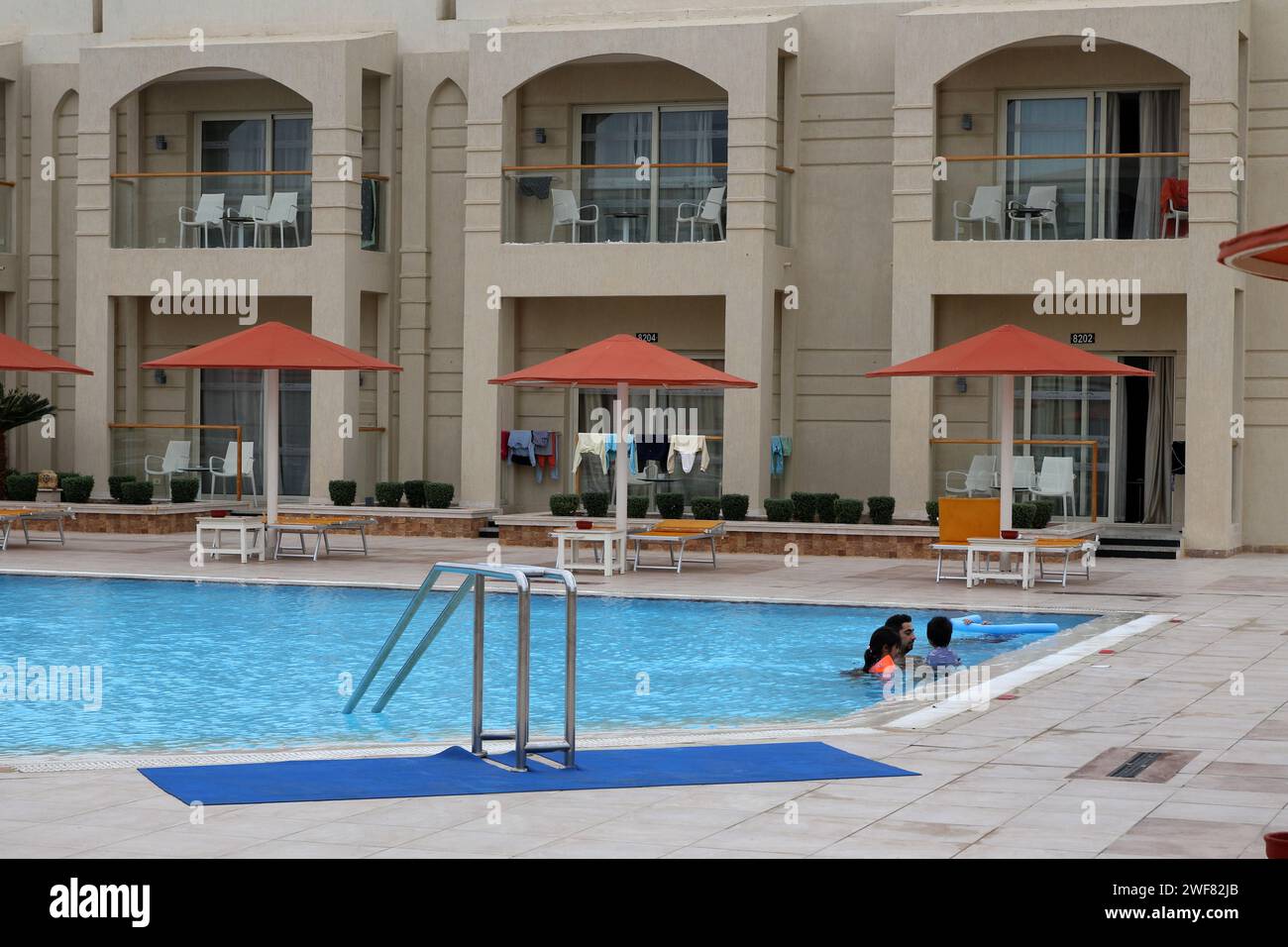 Sharm El Sheikh, Egypt. 28th Jan, 2024. Tourists swim in the pool of ...