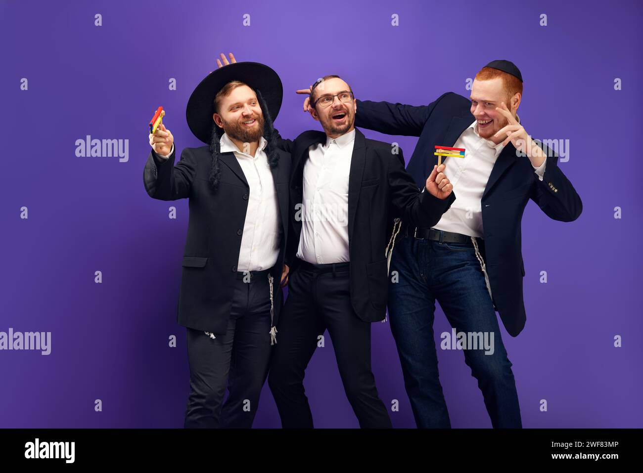 Enjoyment. Three Jewish men, friends in traditional Jewish attributes ...