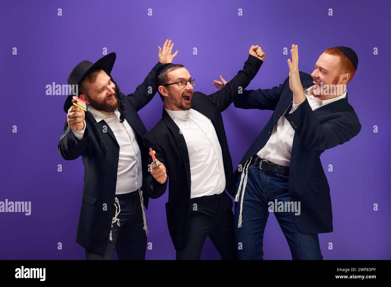 Enjoyment. Three Jewish men, friends in traditional Jewish attributes ...