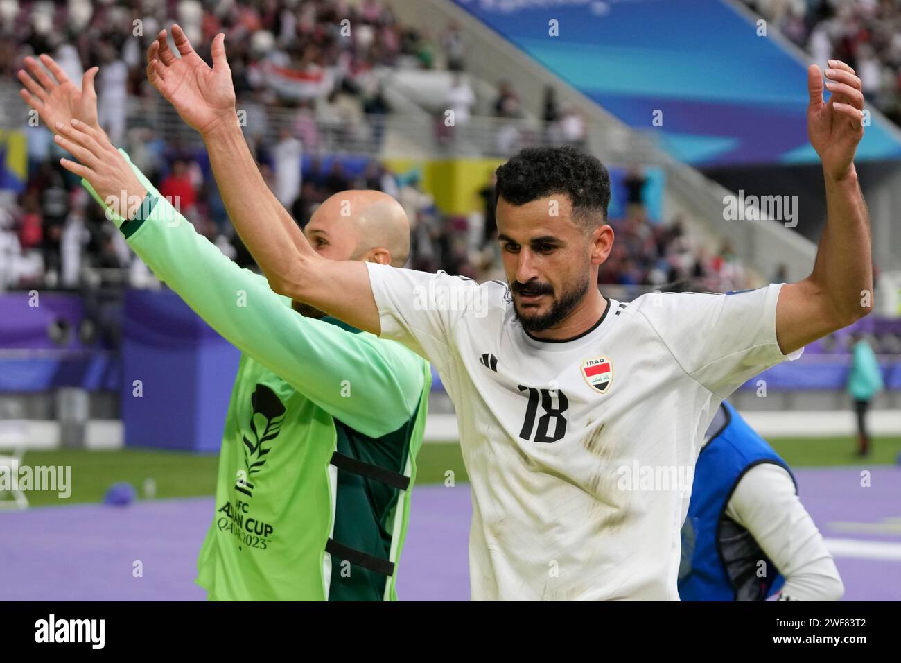 Iraq's Aymen Hussein, right, celebrates after scoring his side's second ...
