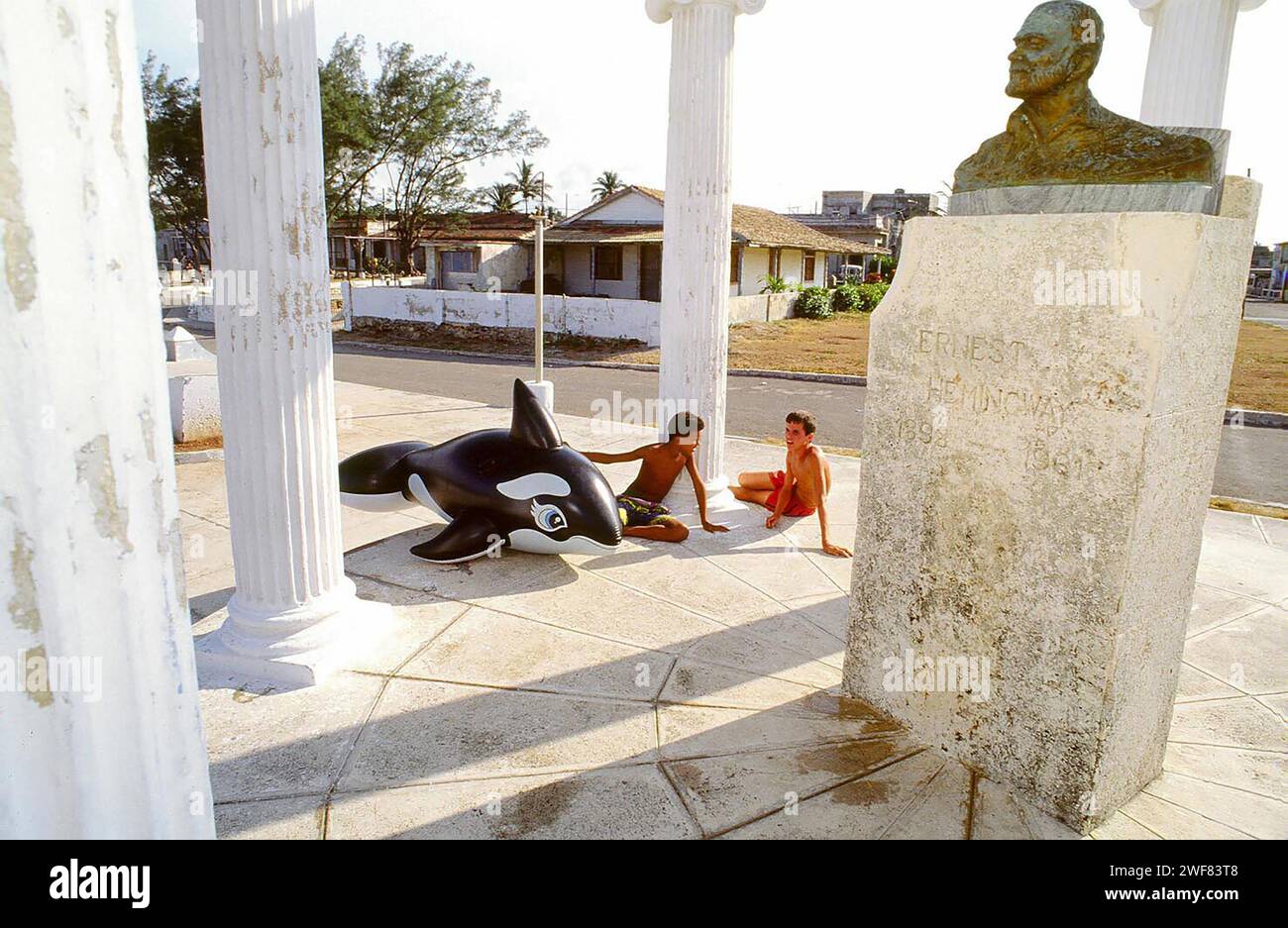 Children take a breather from swimming at the Hemingway monument in ...