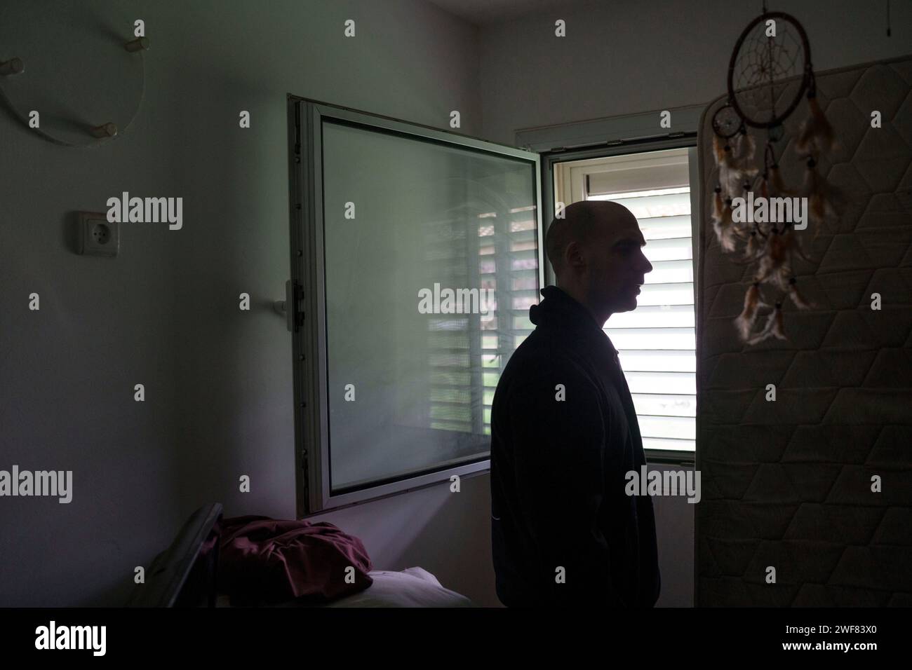 Dor Steinbrecher stands in the house of his sister Doron, who was ...