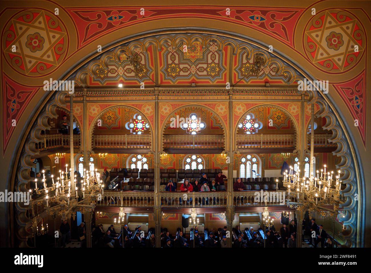 People attend a memorial for the victims of the Holocaust, at the Coral ...