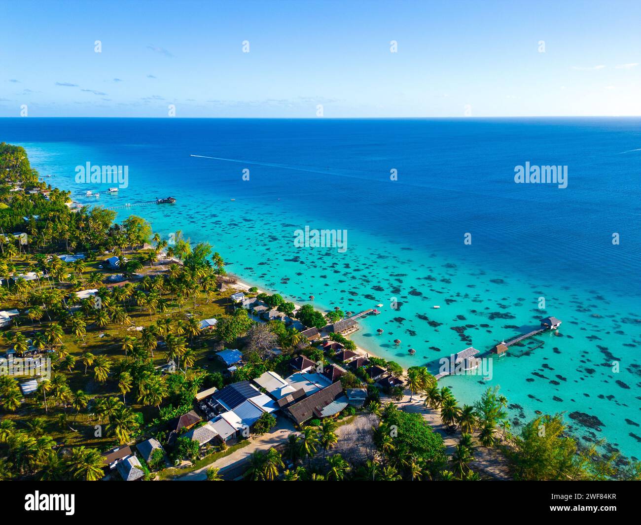 Aerial view of Havaiki Lodge showing lagoon and pacific ocean of ...