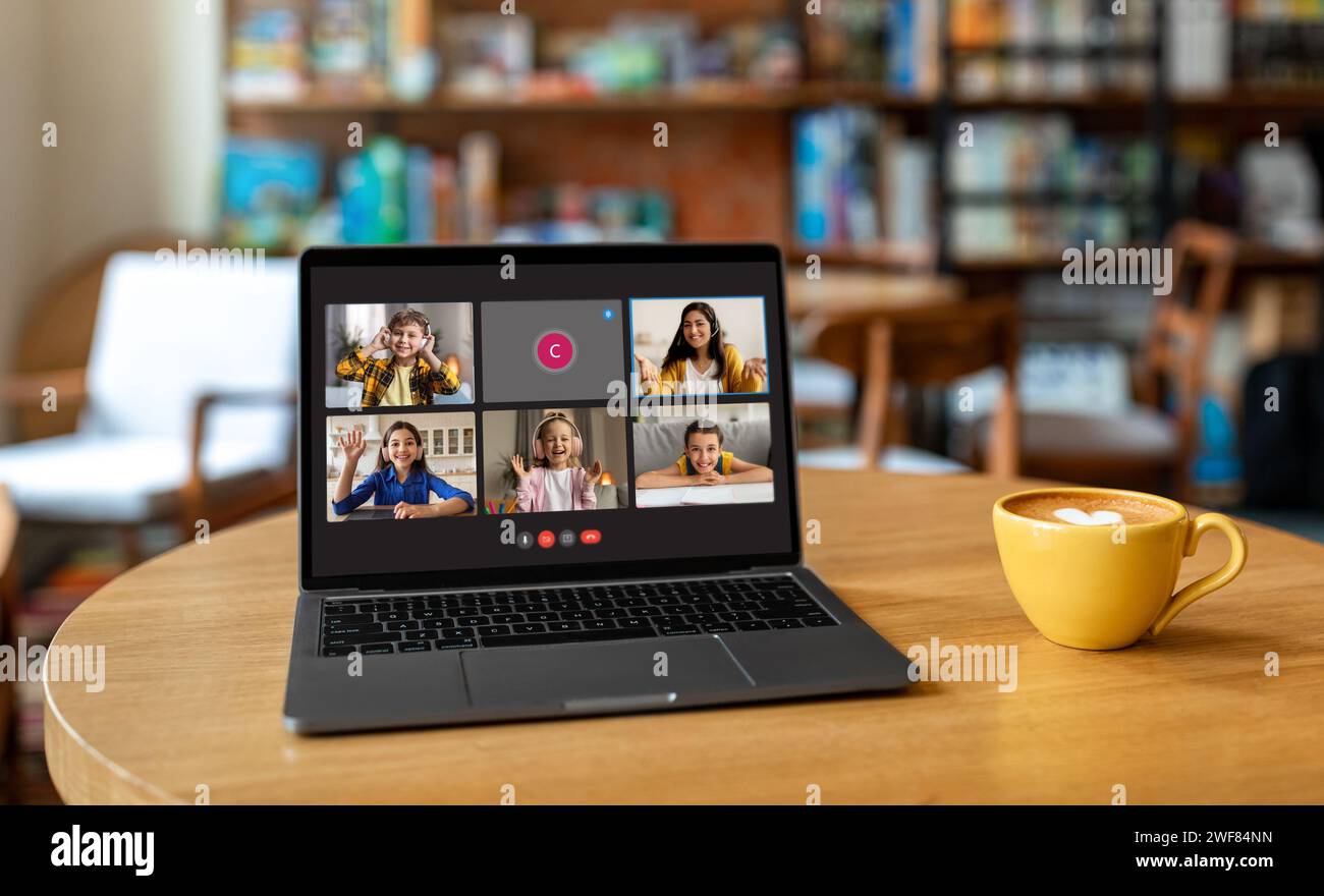 Laptop with video call online class screen on cafe table Stock Photo ...