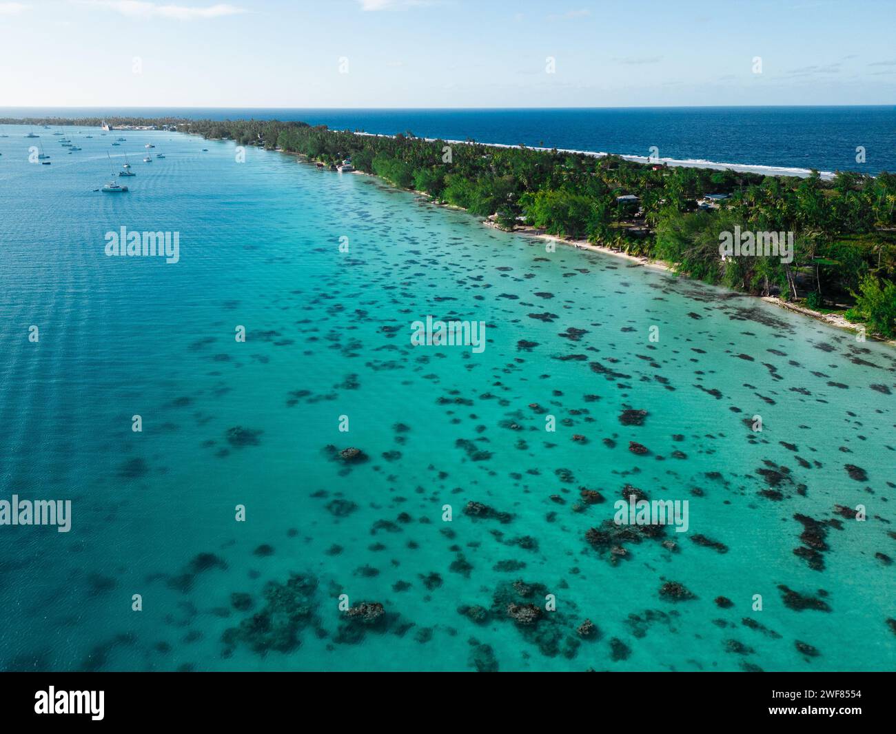 Aerial view of Havaiki Lodge showing lagoon and pacific ocean of ...
