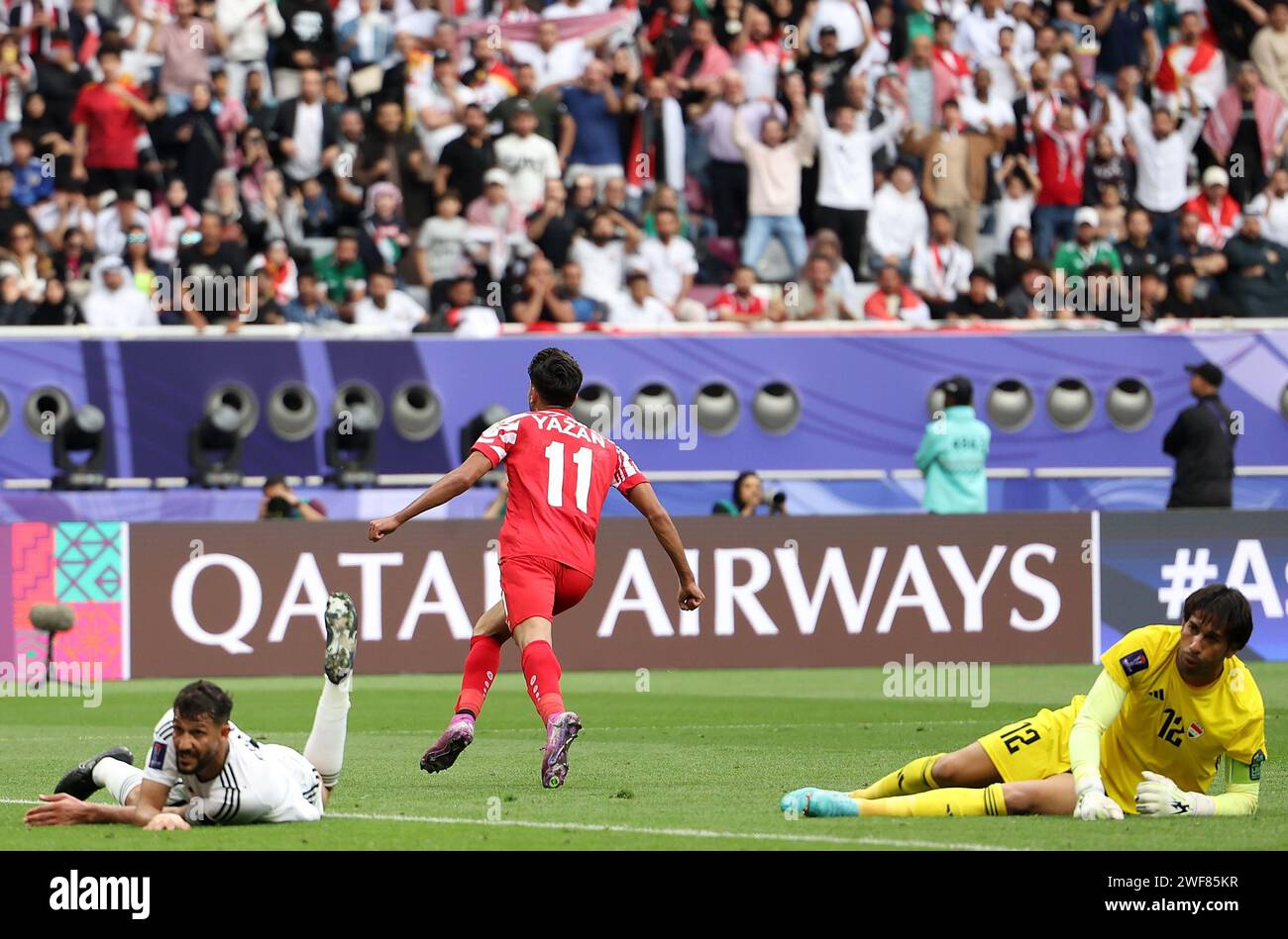 Doha, Qatar. 29th Jan, 2024. Jordan's Yazan Alnaimat (C) celebrates ...