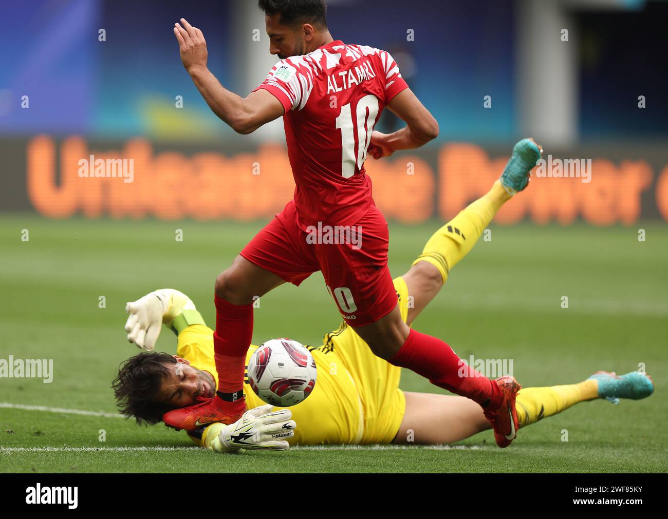 Doha, Qatar. 29th Jan, 2024. Jordan's Mousa Al Tamari (top) steps on ...